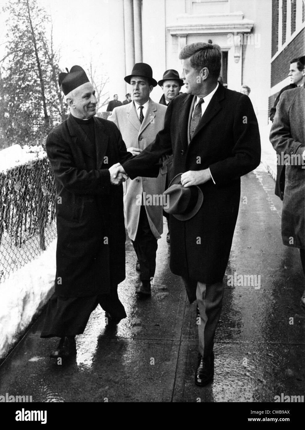 President-elect John F. Kennedy shakes hands with Father Richard J ...