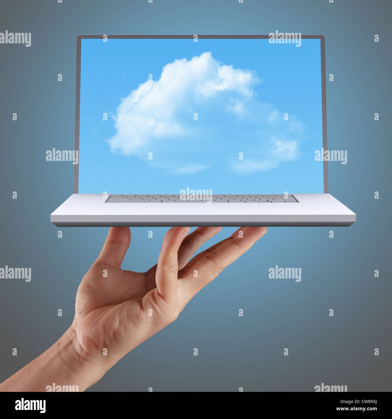 hand shows cloud computing, laptop in front of virtual cloud Stock Photo - Alamy