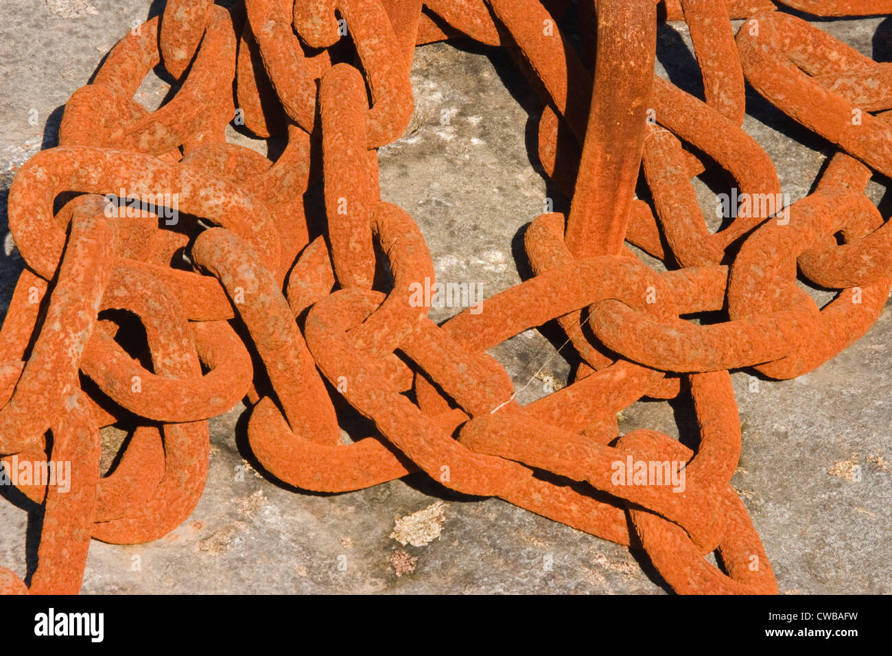Rusty old chain on granite mooring block Stock Photo - Alamy