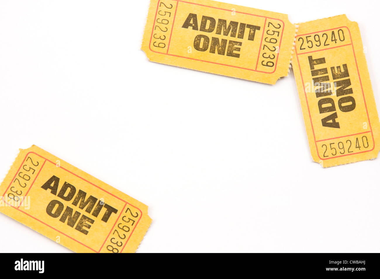 Yellow tickets on white background Stock Photo - Alamy