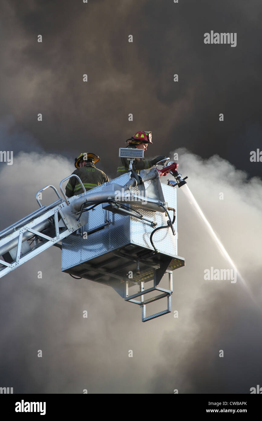 Highland Park Fire Department Aerial Platform pouring water on vacant ...