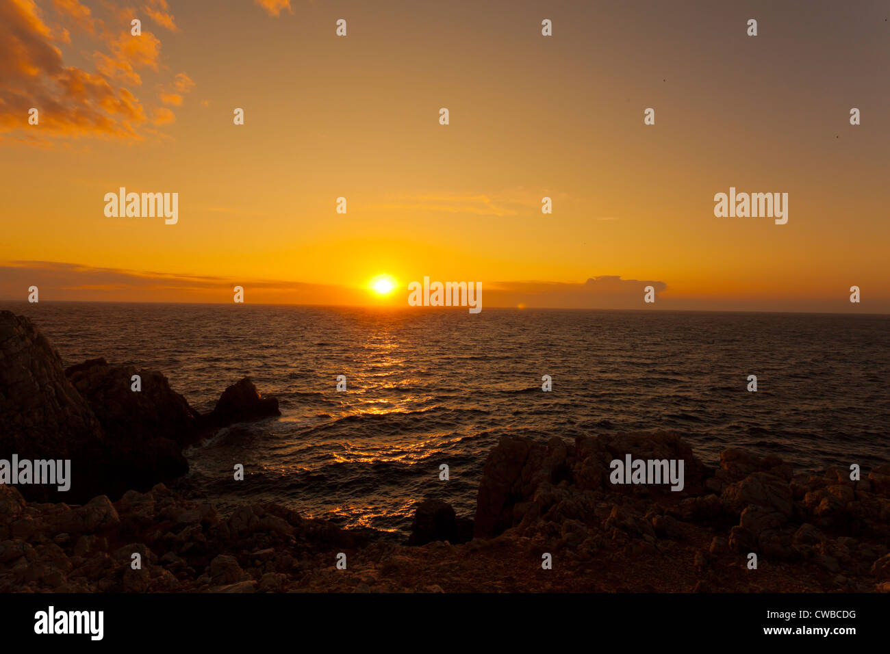 Sunset at Lighthouse Menorca Punta Nati Stock Photo - Alamy