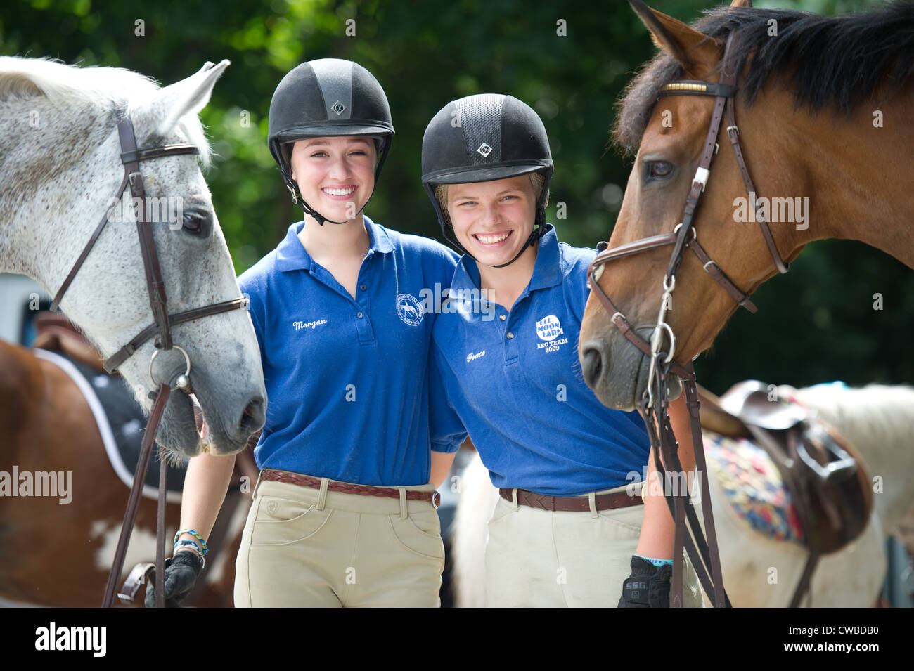 Horseback riding at equestrian stables Stock Photo - Alamy