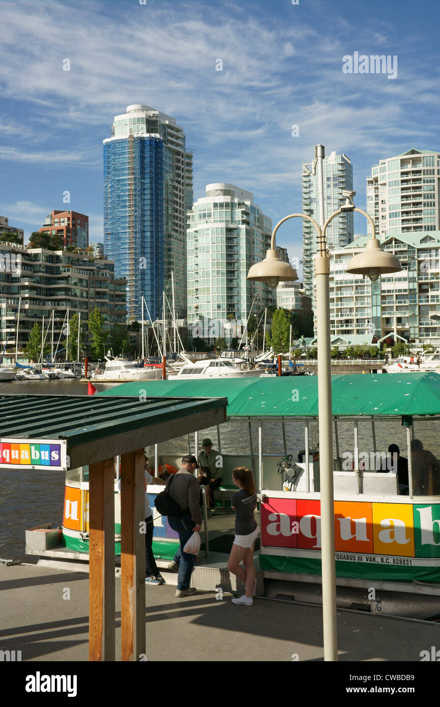 Tourist boarding the aquabus harbour tour boat, Granville Island ...