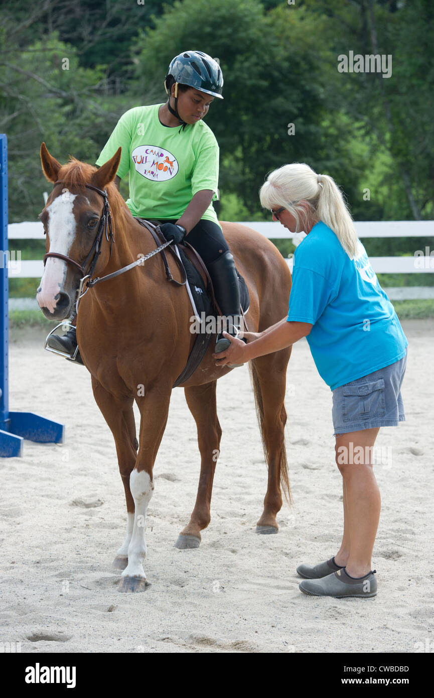 Horseback riding at equestrian stables Stock Photo - Alamy