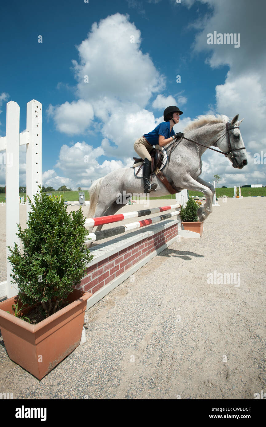 Horseback riding at equestrian stables Stock Photo - Alamy