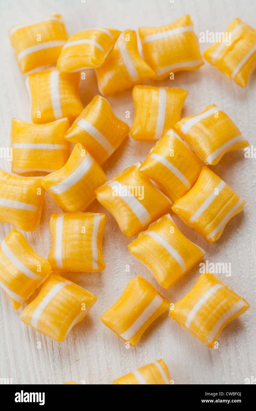 Close-up of hard yellow candy with white stripes Stock Photo - Alamy