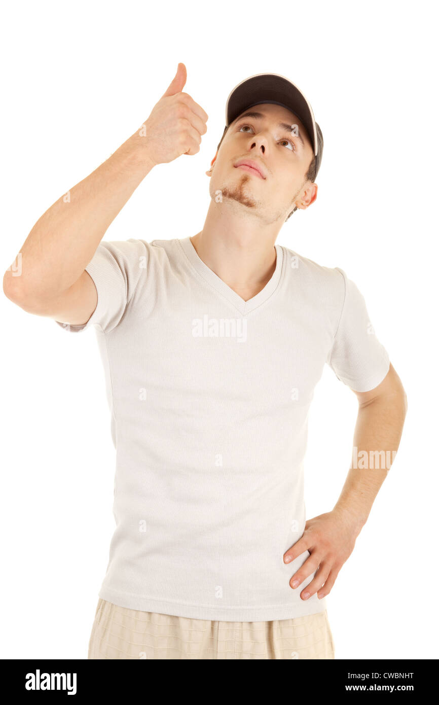 Casual young man in a hat is pointing and looking up. Isolated on white ...