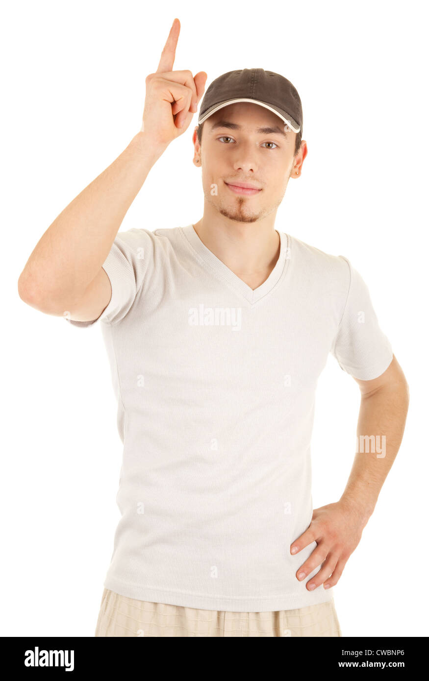 Casual young man in a hat is pointing up. Isolated on white Stock Photo ...