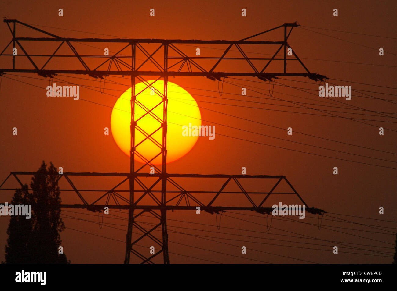 Sunset landscape glowing power symbol hi-res stock photography and ...