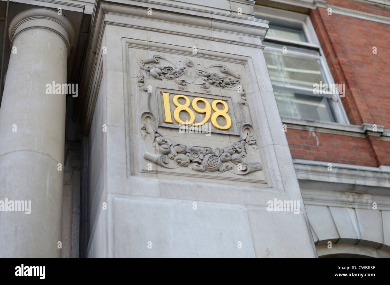 1898 stone plaque on exterior of Victorian building, London, England ...