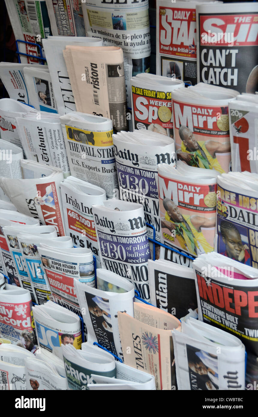 Lots of different newspapers on a stand Stock Photo - Alamy