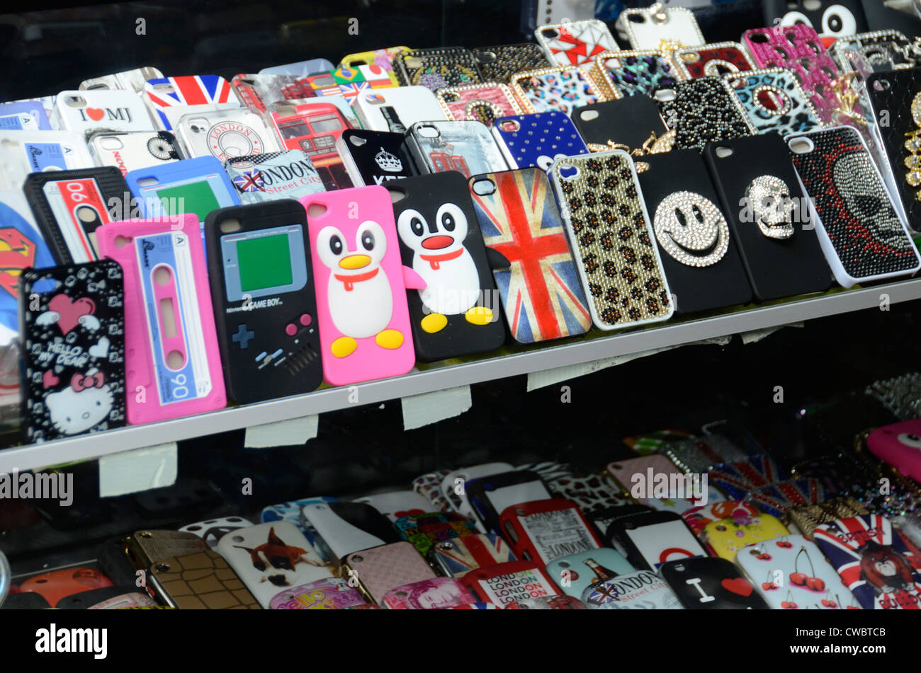Smartphone covers on display in a shop window Stock Photo - Alamy