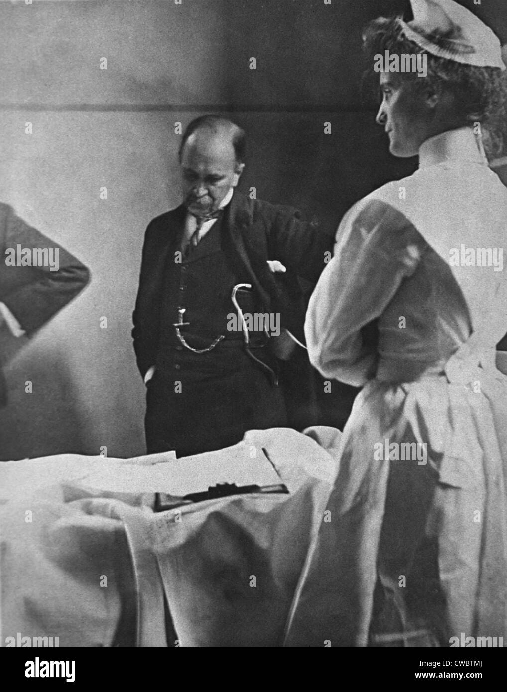 Sir William Osler (1849 – 1919), reading a patient's chart at bedside ...