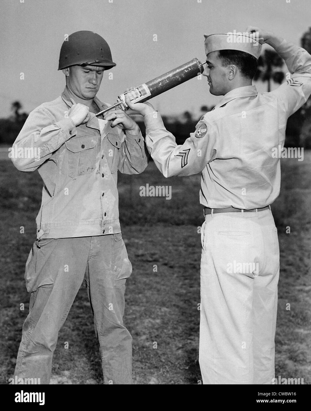 A U.S. soldier applying the insecticide DDT to kill mosquitoes that ...