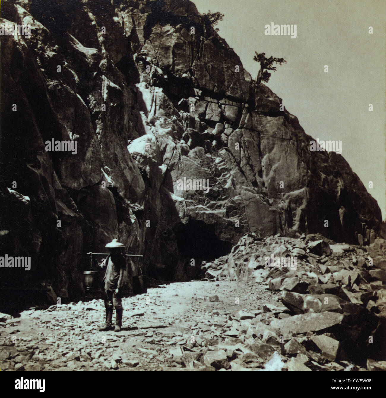 Chinese railroad worker wearing traditional clothing and hats while ...