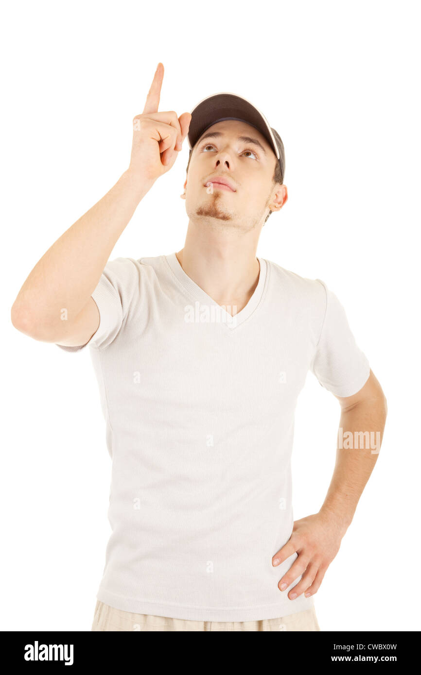 Casual young man in a hat is pointing and looking up. Isolated on white ...
