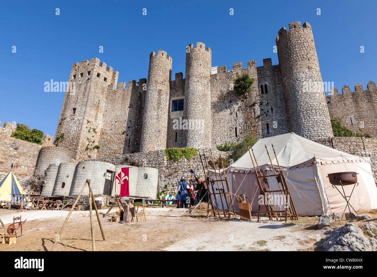 Obidos Castle during the Medieval Fair reenactment. Obidos is a very ...