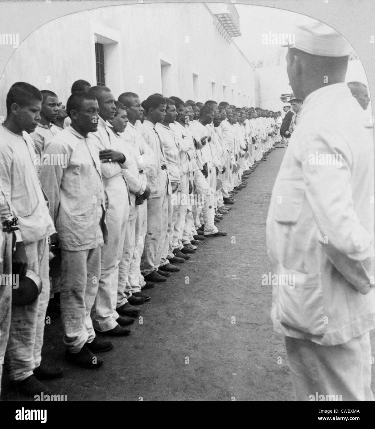 500 prisoners in formation against a wall, under guard, at the San Juan ...