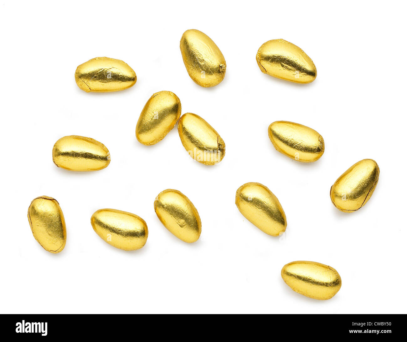 Group of gold almonds Stock Photo - Alamy
