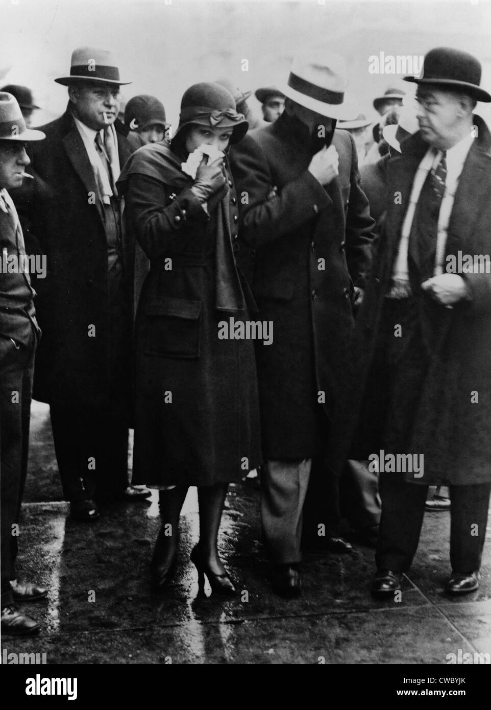 Mr. and Mrs. Vincent Coll, hiding their faces from photographers as ...