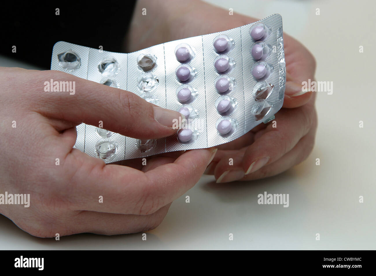 Hand with pill pack Stock Photo - Alamy