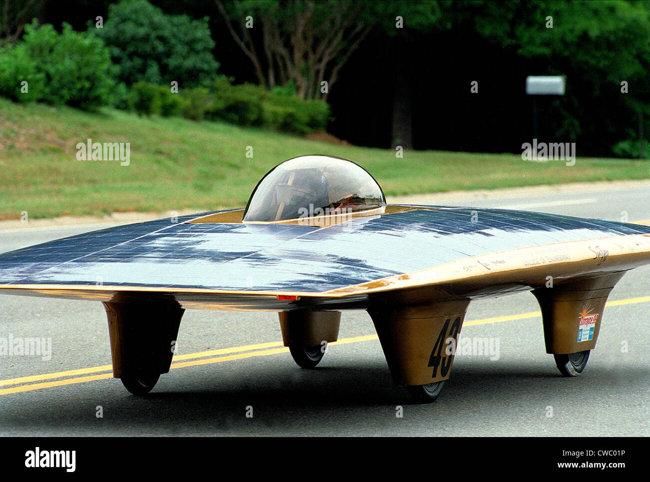Solar car on the road during the SUNRAYCE 1999 race of experimental ...