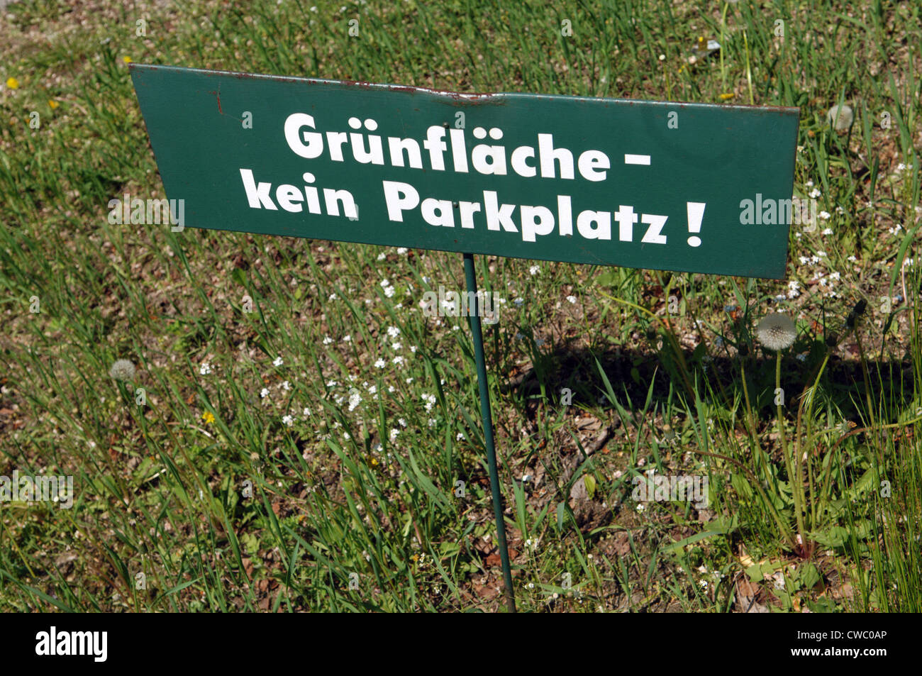 Sign on a greenery, Berlin Stock Photo - Alamy