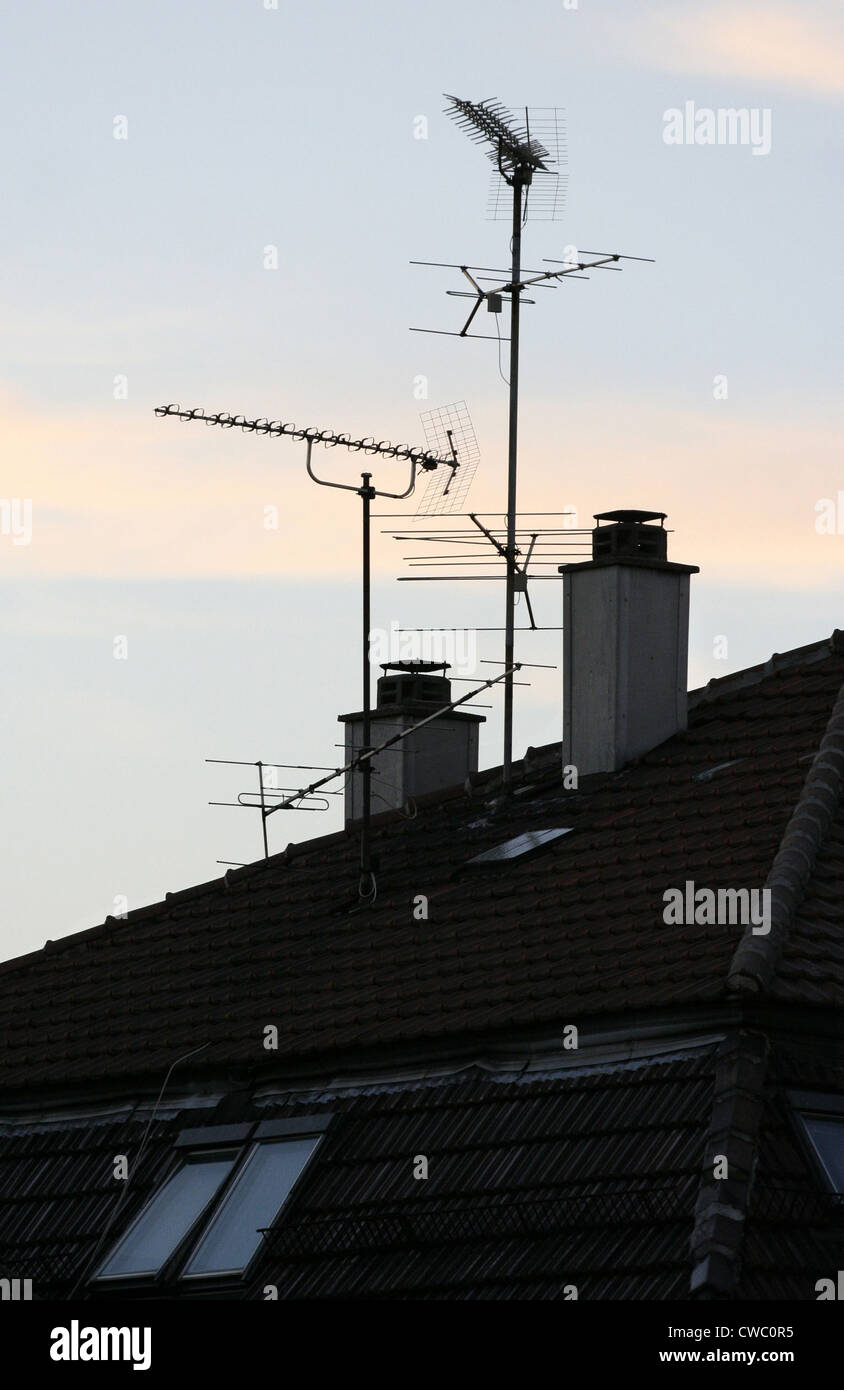 Antennas on a rooftop Stock Photo - Alamy