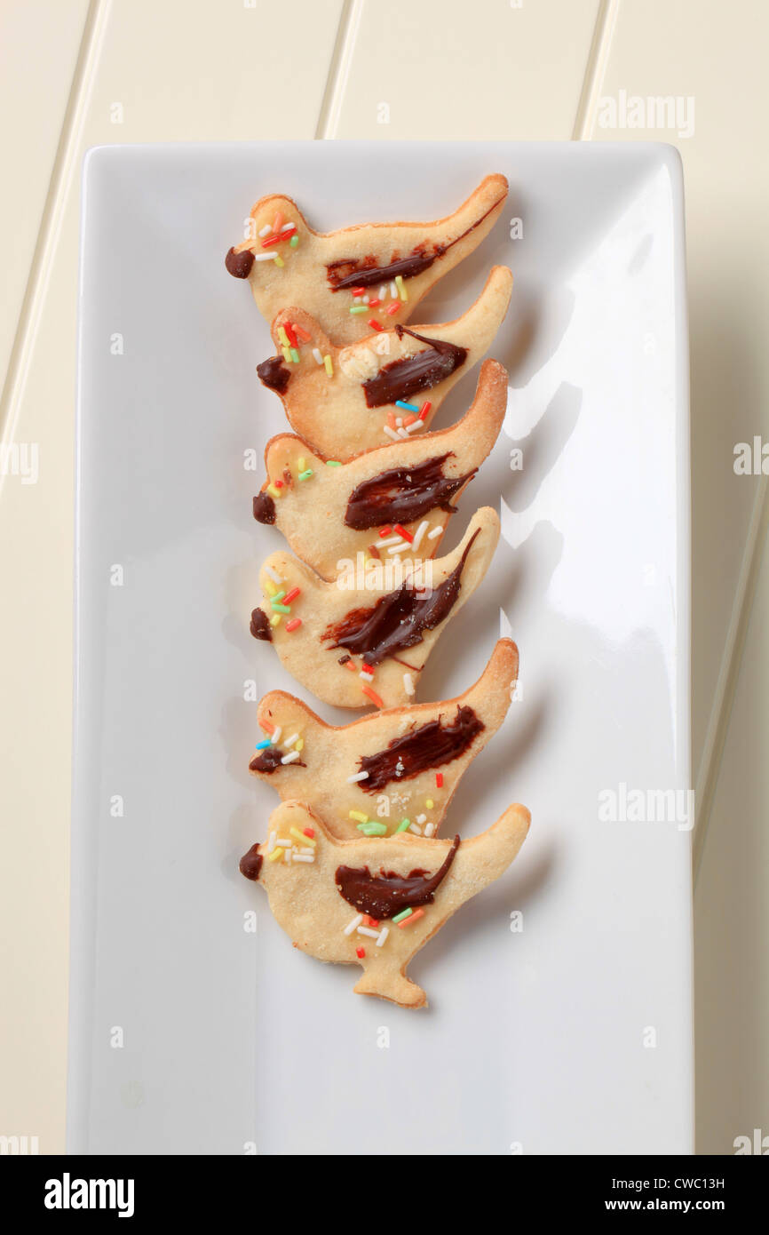 Bird-shaped shortbread cookies decorated with chocolate and sprinkles ...