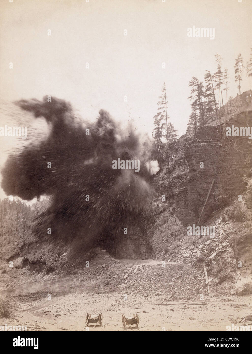 Smoke from a dynamite blast during railroad construction near Deadwood ...