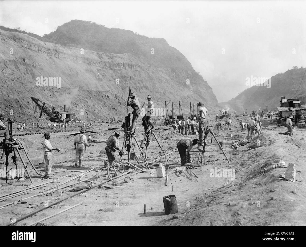 Panama Canal construction showing workers drilling holes for dynamite ...