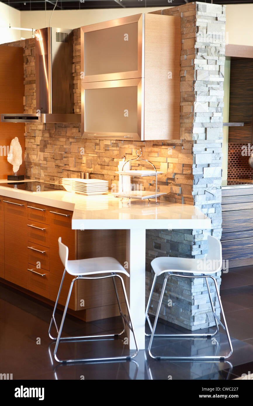 Modern dining table in store Stock Photo - Alamy