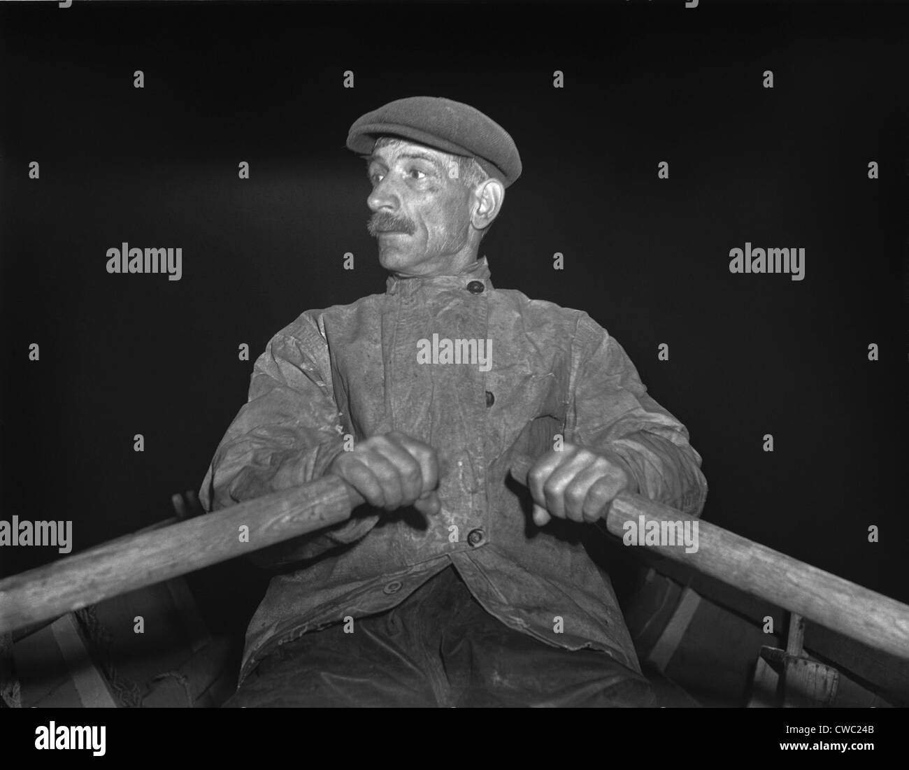 Portuguese dory fisherman rowing out to his boat at 4 30 in the morning ...