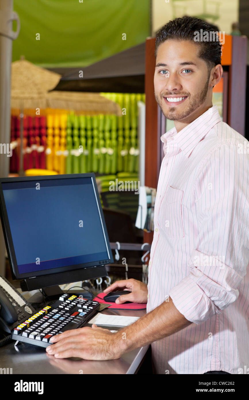 Portrait of a happy salesperson in store Stock Photo - Alamy