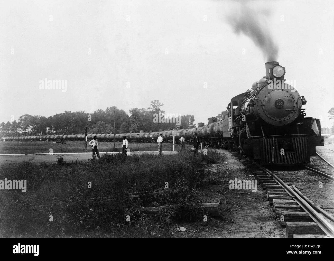 Pedestrians waiting at a railroad crossing for Louisiana Arkansas ...