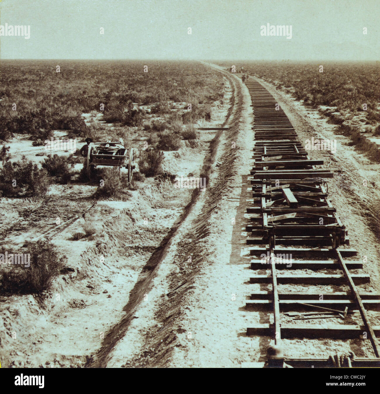 ADVANCE OF CIVILIZATION. Railroad tracks under construction near Iron ...