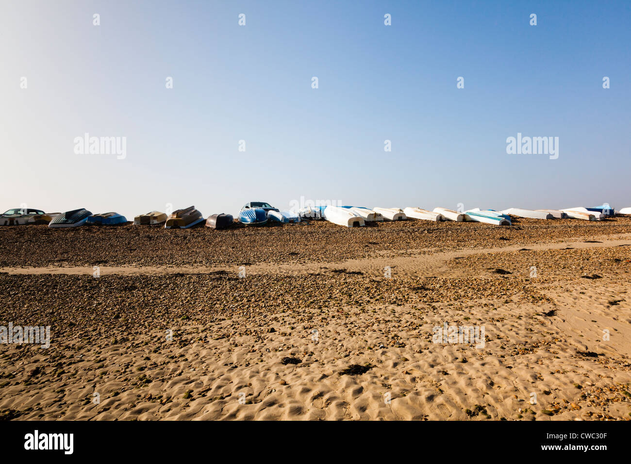 Dinghys lined up on the beach, Eastney, Langstone Harbour, UK Stock ...