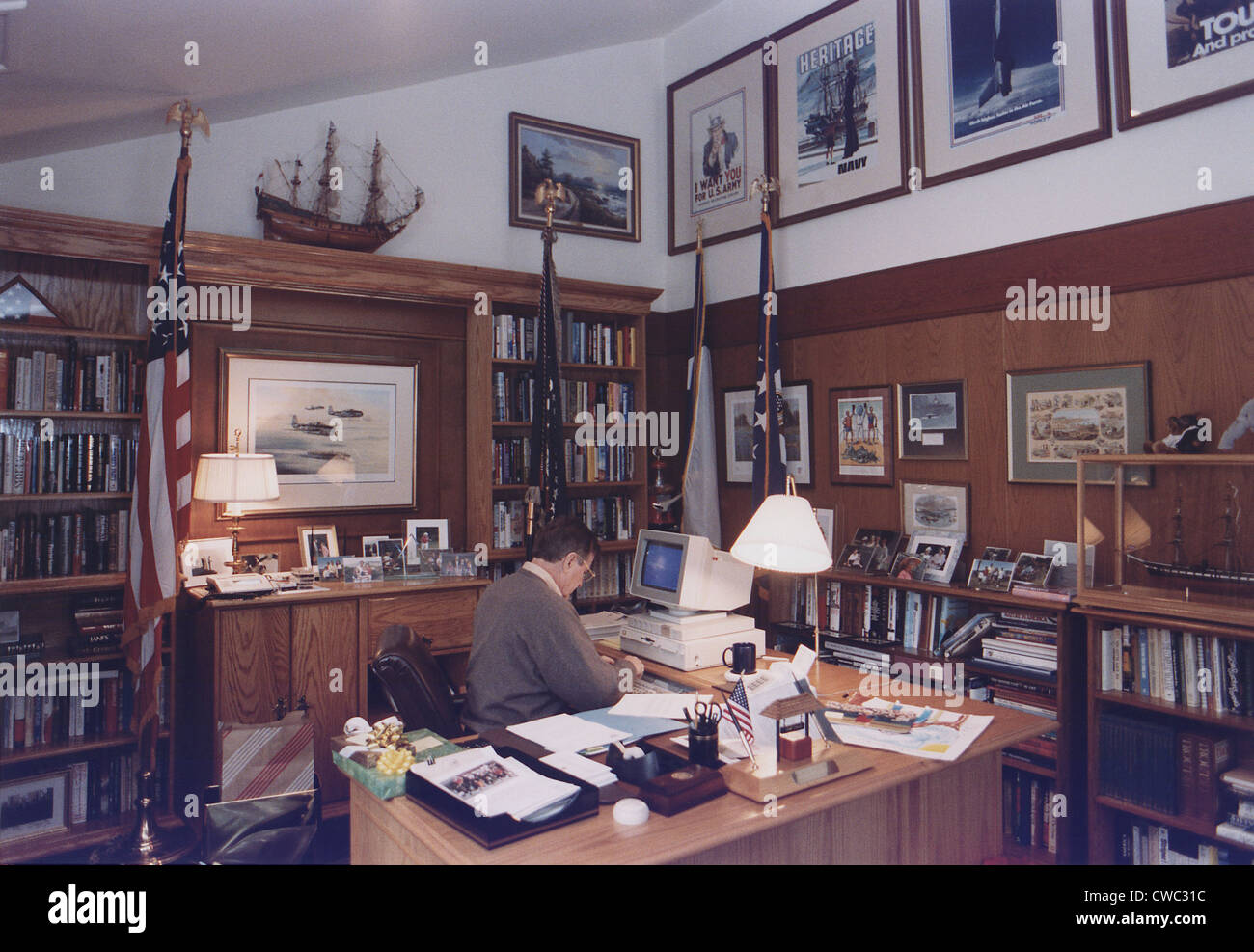 President George Bush works on a personal computer at Laurel Lodge at ...