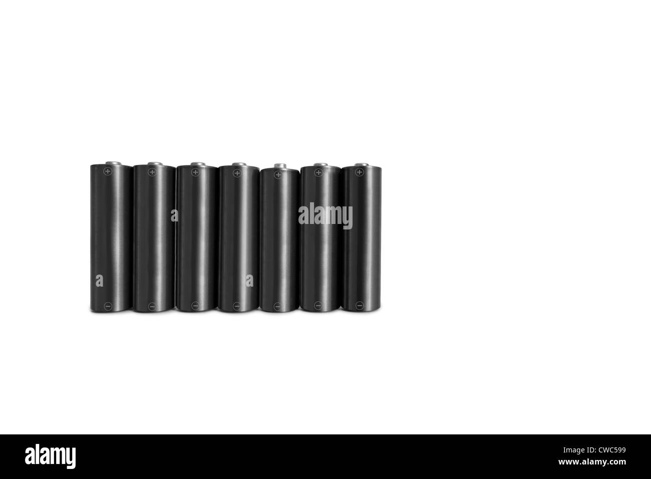 Close-up of black batteries over white background Stock Photo - Alamy