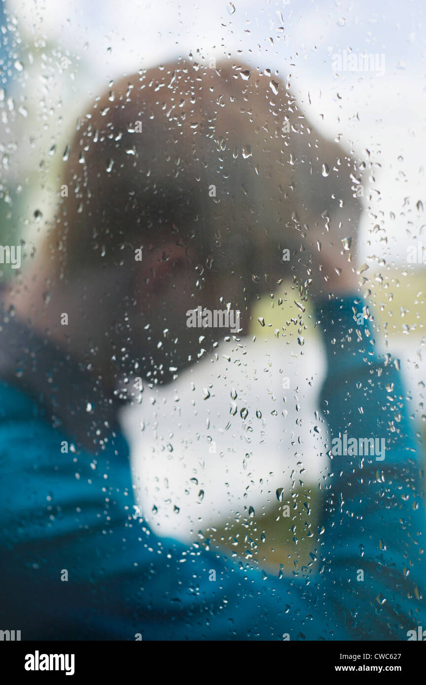 Man behind a glass Stock Photo - Alamy