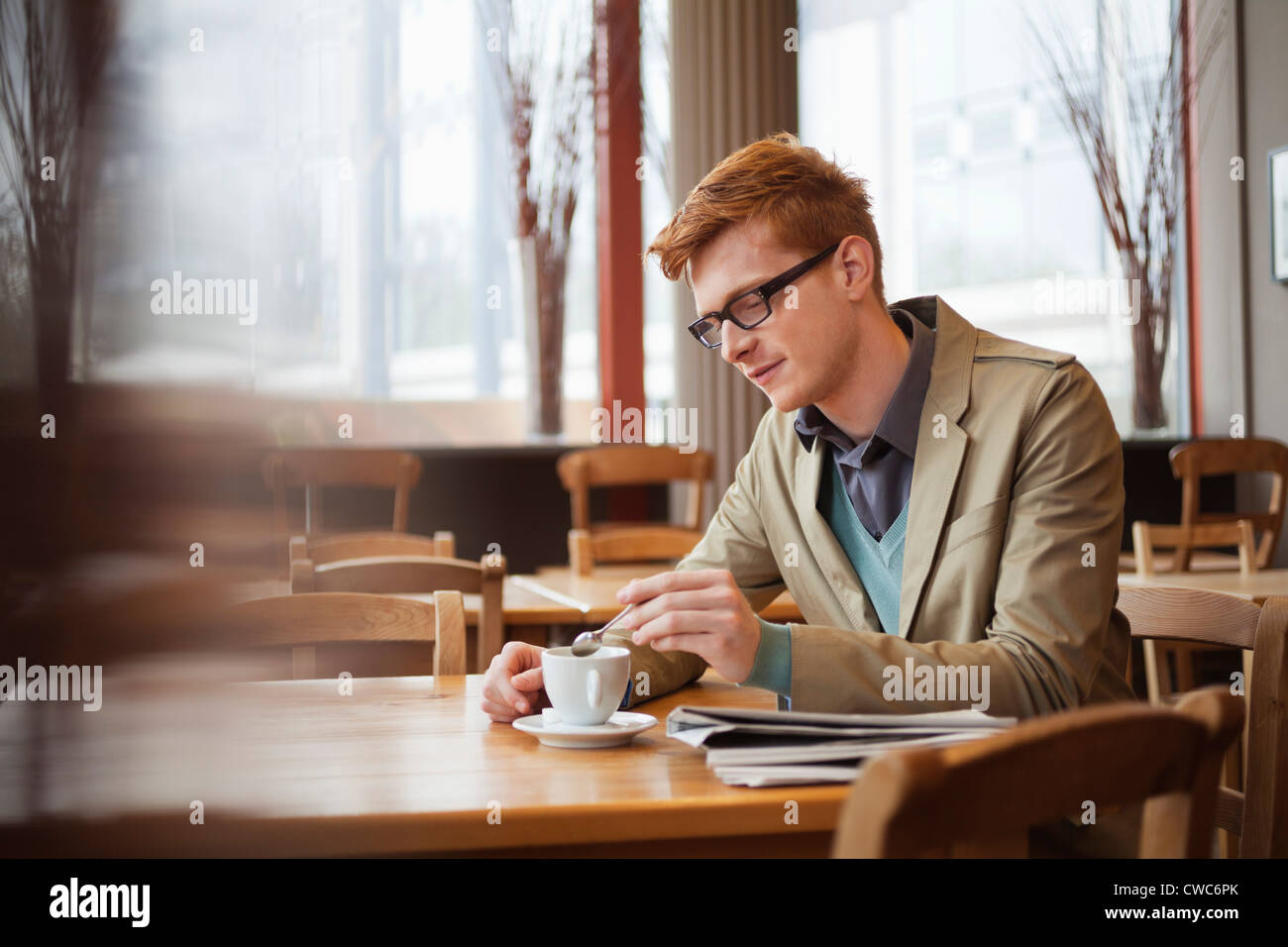 Man drinking tea in a restaurant Stock Photo - Alamy