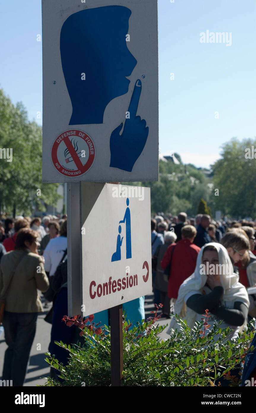 Believers pray at the Grotto of Massiabelle in Lourdes, France Stock ...