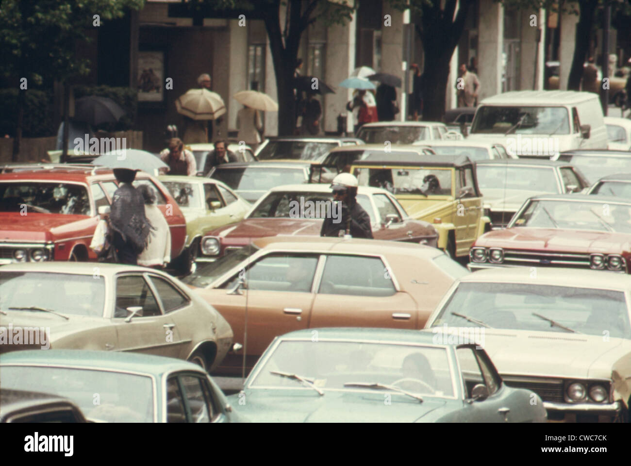 A Washington D.C. policeman stands among gridlocked cars during a bus ...