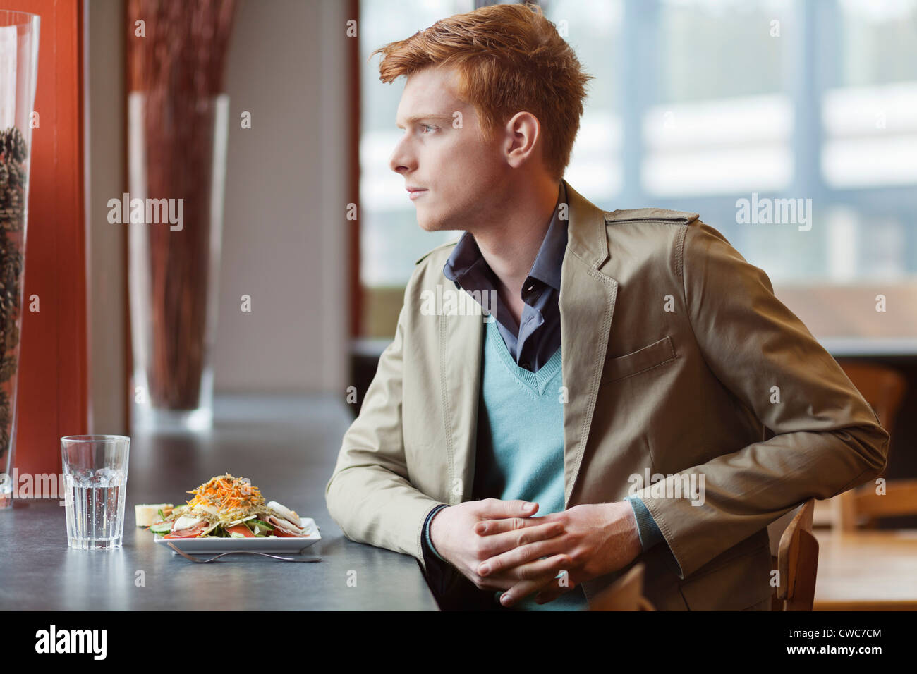 Man sitting in a restaurant taking lunch Stock Photo - Alamy