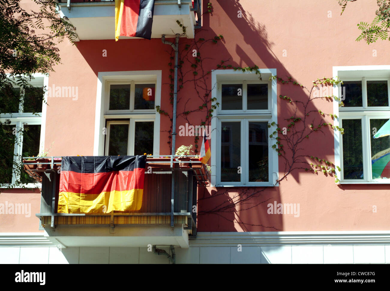 Berlin, Germany flags hanging from a tenement Stock Photo - Alamy