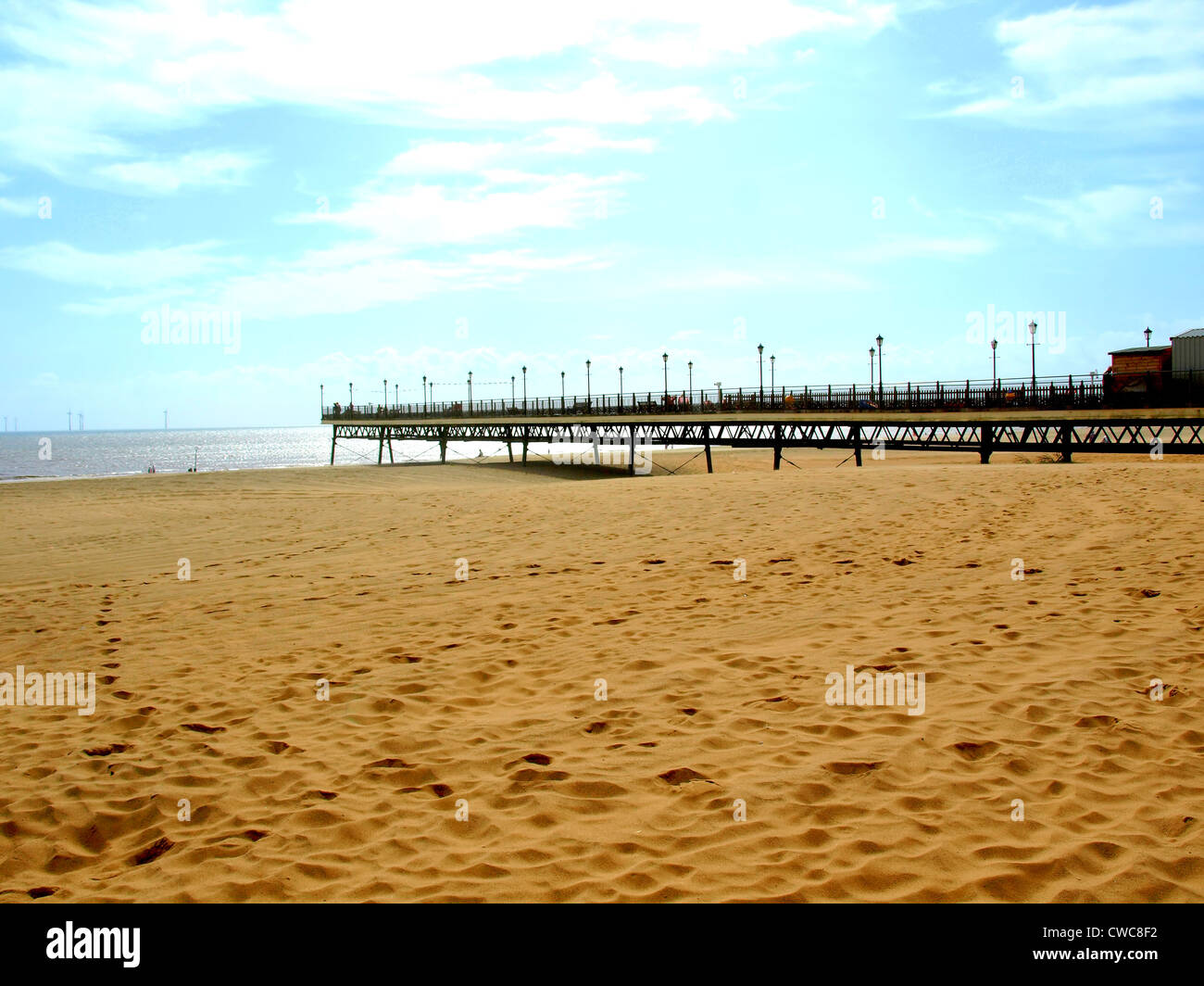 Skegness pier taken early in the morning with the sun on the horizon ...