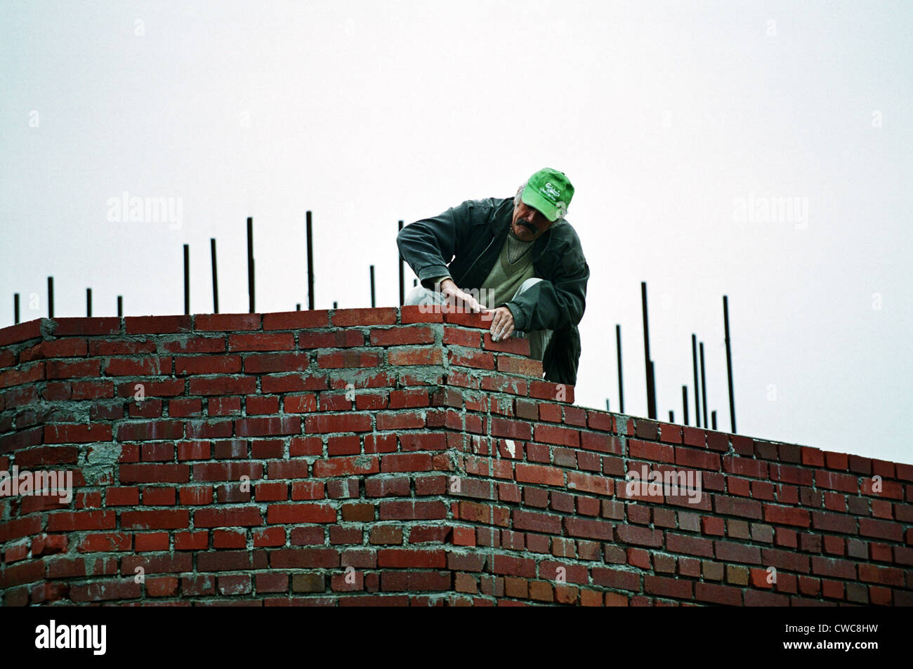 A bricklayer at work, Romania Stock Photo - Alamy