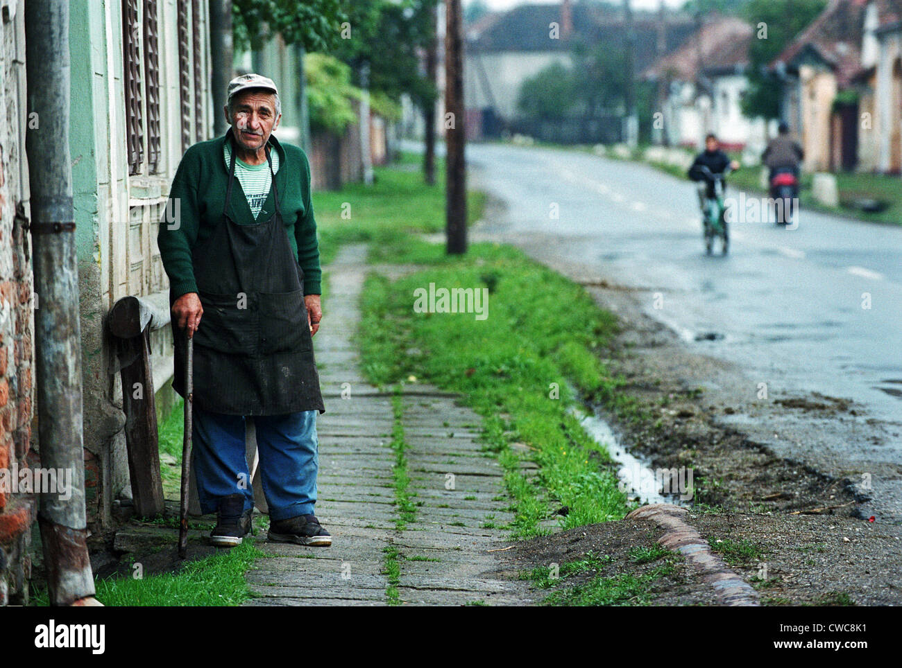 A native of older front of his house, Romania Stock Photo - Alamy