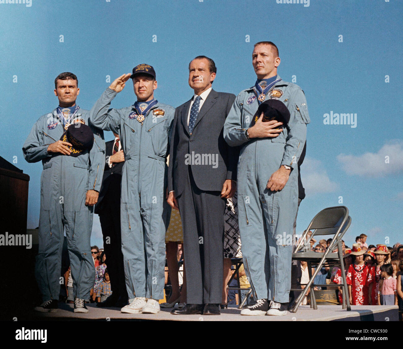 President Richard Nixon and the Apollo 13 crew salute U.S. flag. The ...